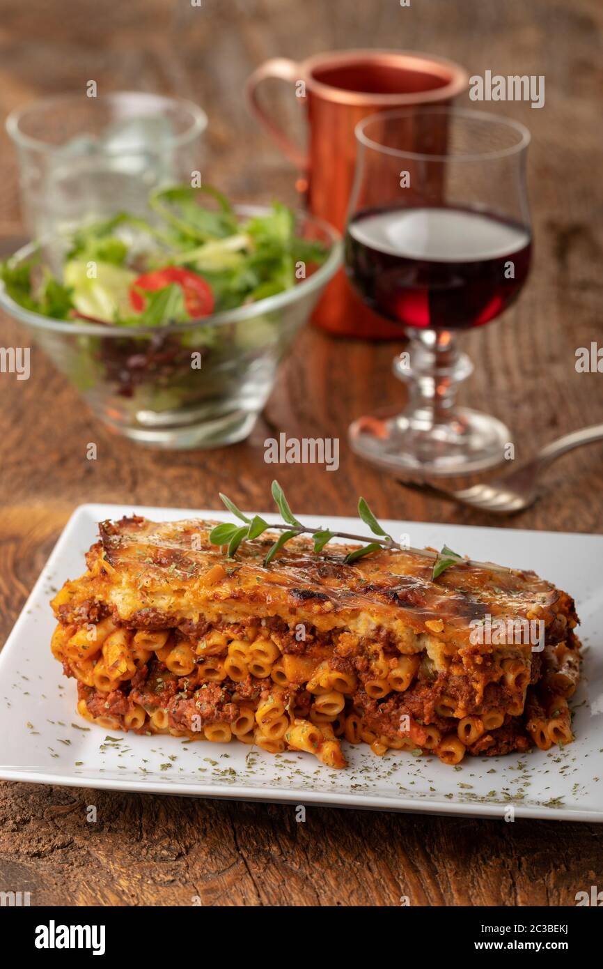 greek pastizio noodle dish with cheese Stock Photo - Alamy