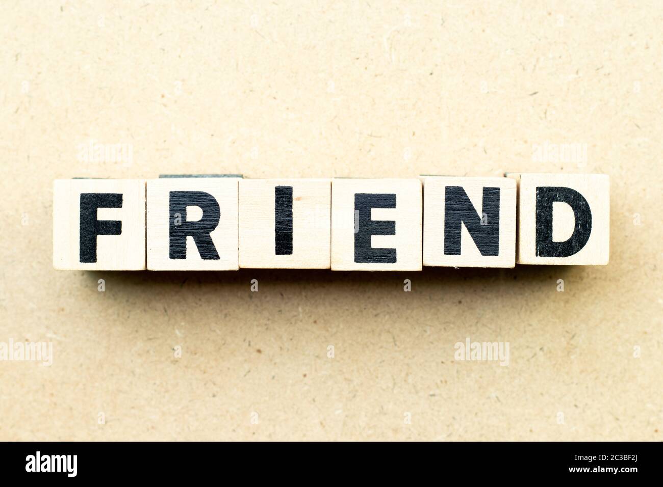 Letter block in word friend on wood background Stock Photo - Alamy