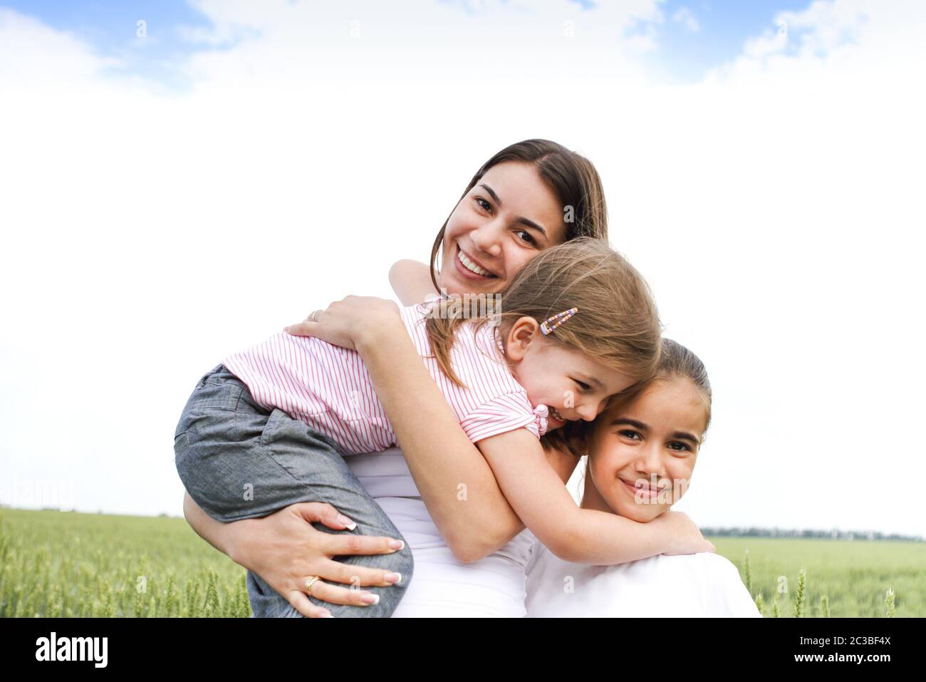 Mother embracing little daughter hi-res stock photography and images ...
