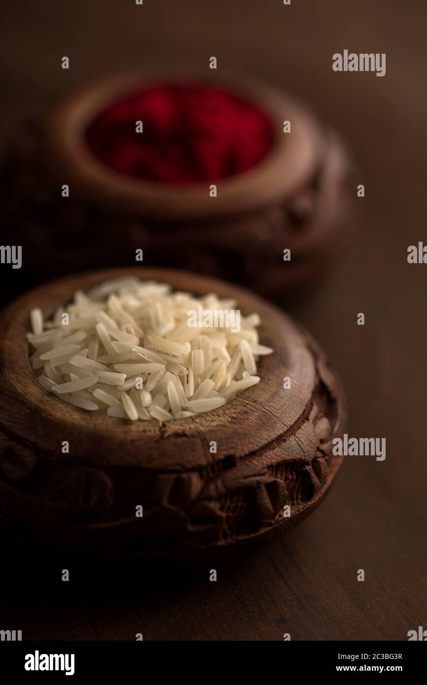 Kumkum and rice grain container. Natural color powders are used while ...