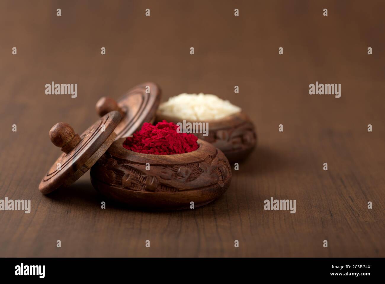 Kumkum and rice grain container. Natural color powders are used while ...