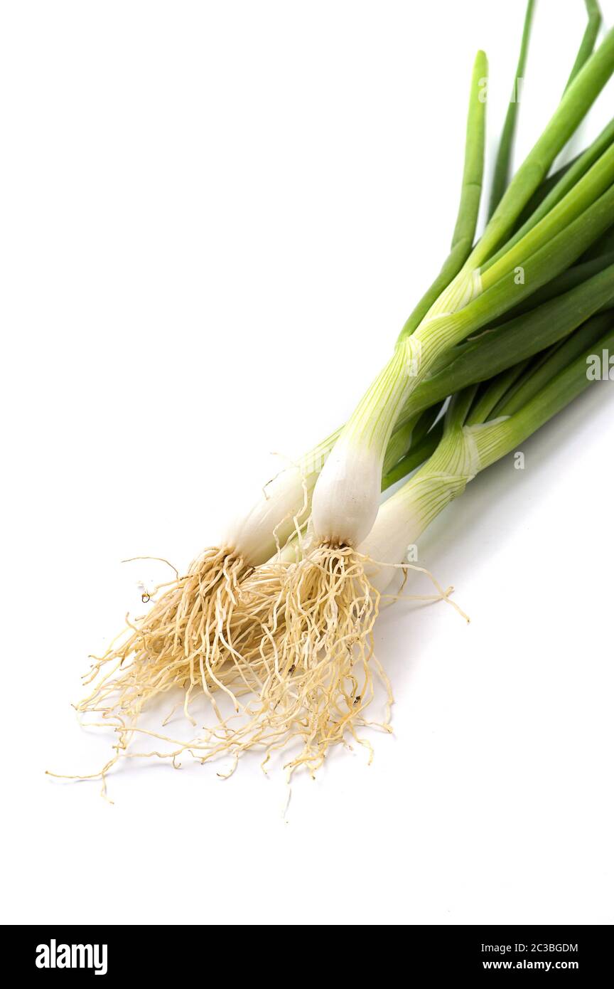 Shallot onions on wooden Cut Out Stock Images & Pictures - Alamy