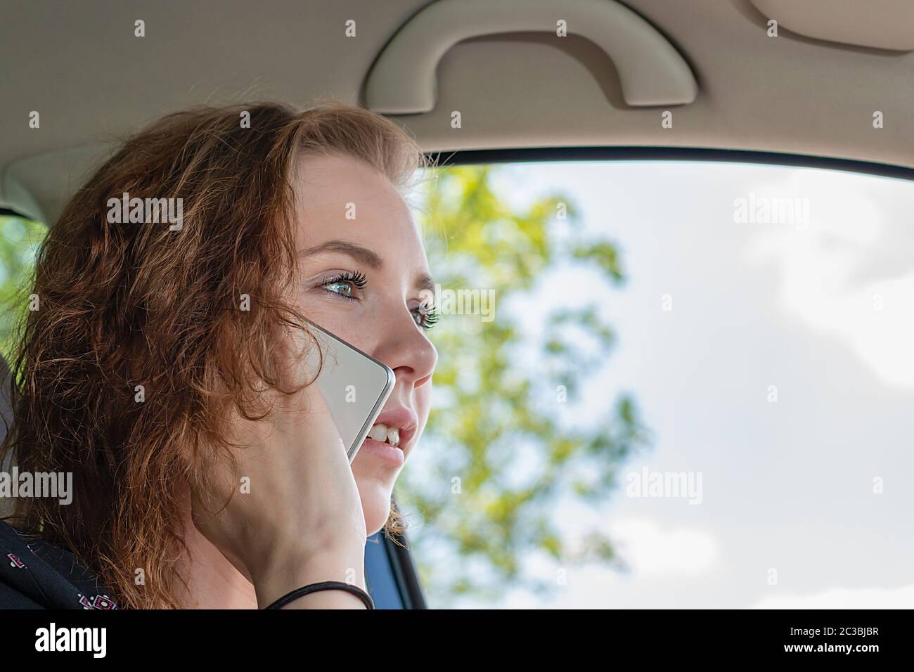 Distracted Woman Busy Talking High Resolution Stock Photography and ...