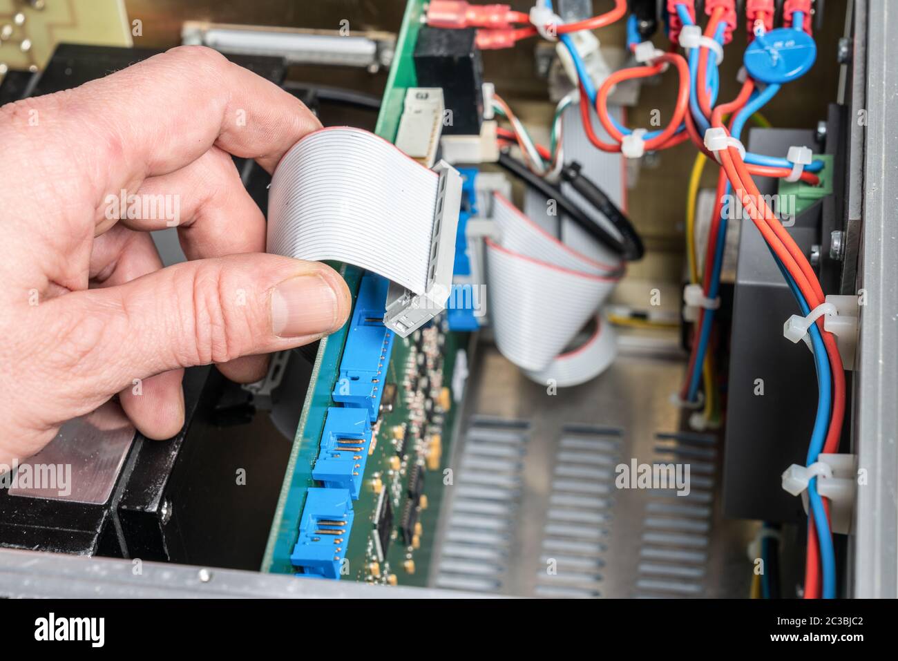 a technician assembles components of a measuring device Stock Photo - Alamy