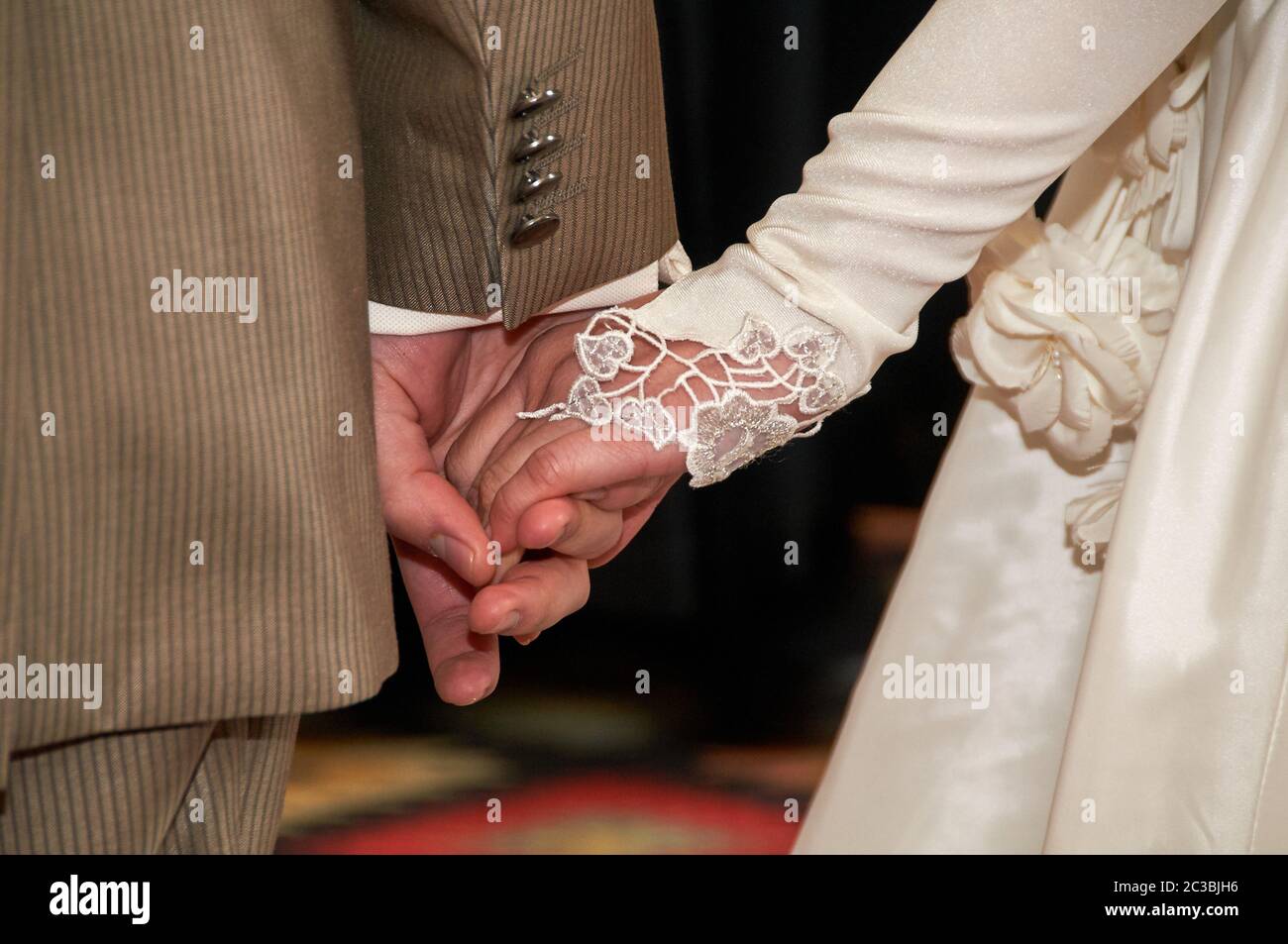 wedding couple hand in hand Stock Photo - Alamy