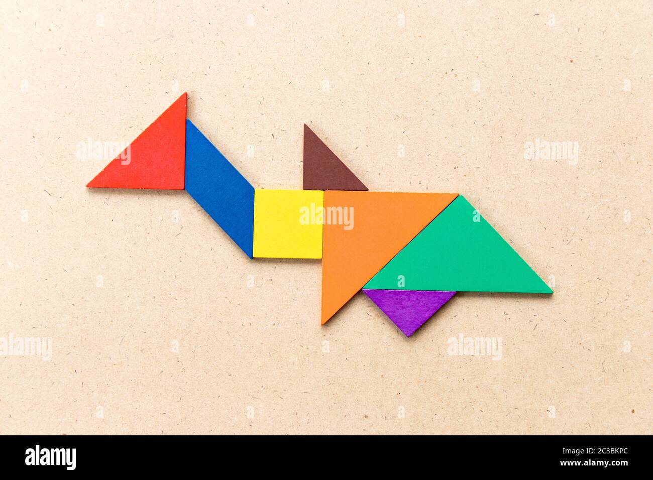 Color tangram puzzle in shark or whale shape on wood background Stock ...