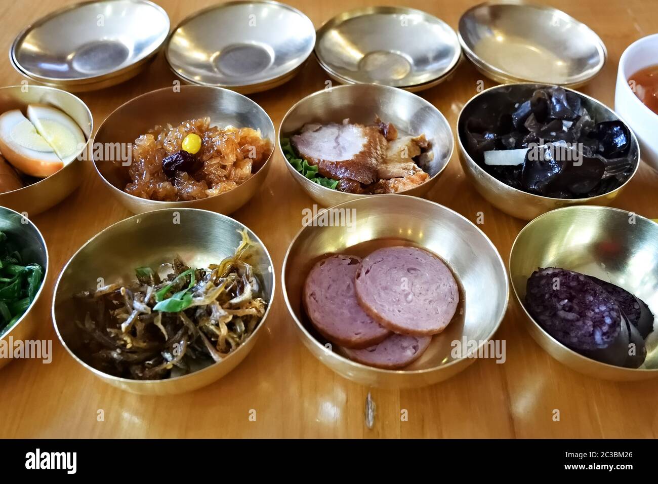 North Korean snacks. Spicy vegetable, kimchi, baked egg, rice, smoked ...