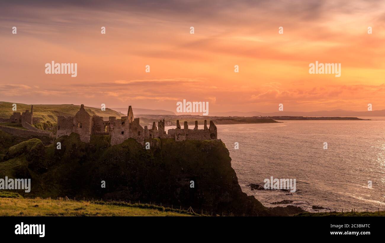 Ruined medieval Dunluce Castle on the cliff in Bushmills, Northern ...