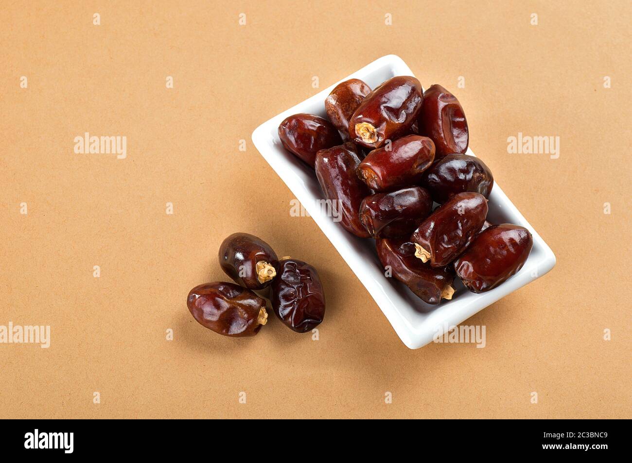Dates in plate. Dried dates fruits Stock Photo - Alamy