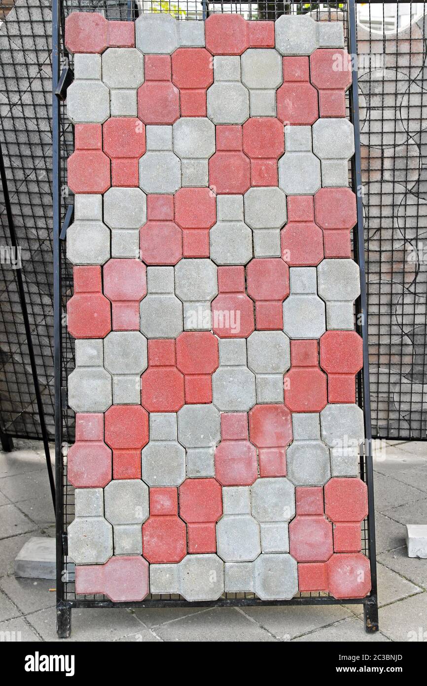 Concrete tiles and bricks for pavement construction Stock Photo - Alamy