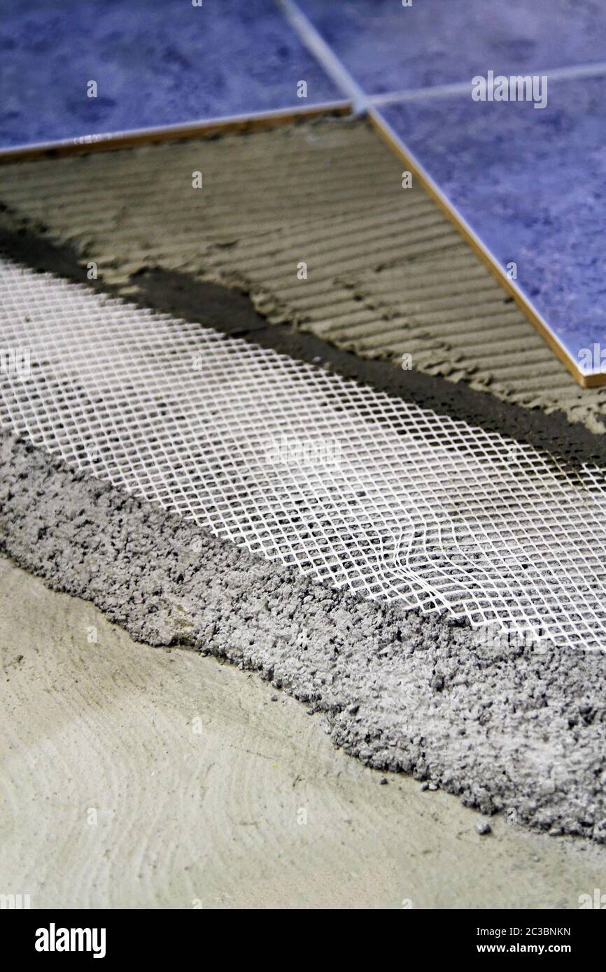 Several layers of construction material for tiles Stock Photo - Alamy