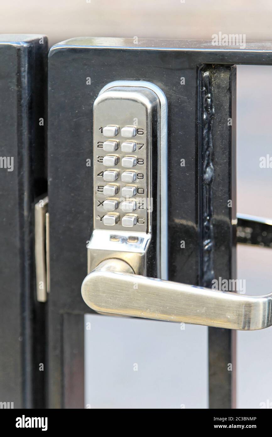Electronic lock with pin code at fence Stock Photo - Alamy