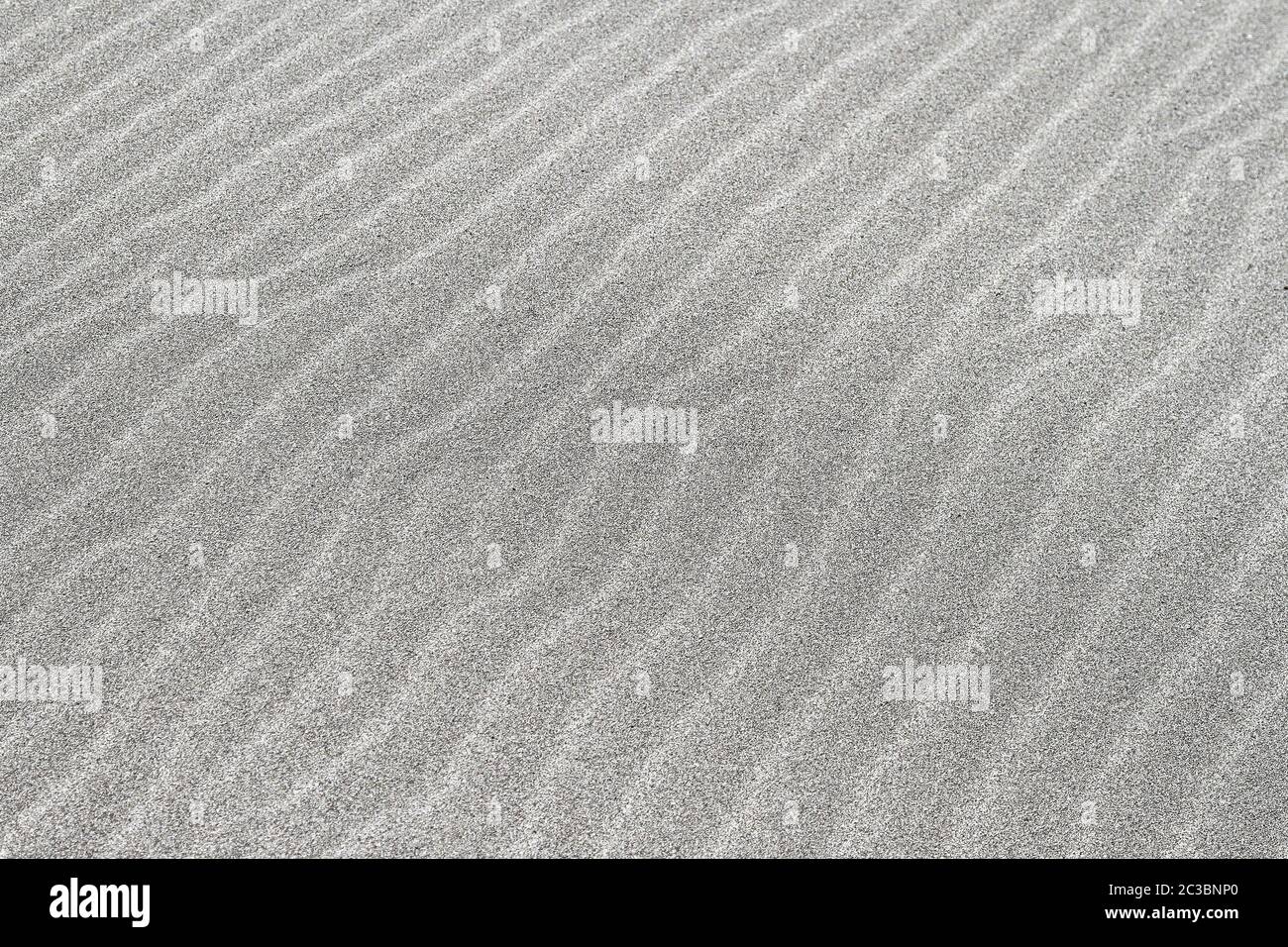 Granular grey sand dunes with diagonal pattern Stock Photo - Alamy