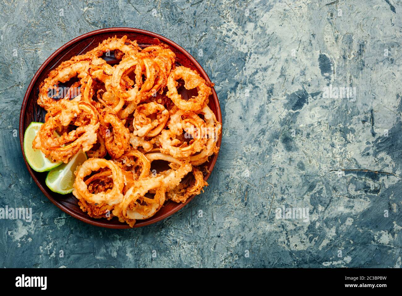 Crunchy deep fried squid rings in batter Stock Photo - Alamy