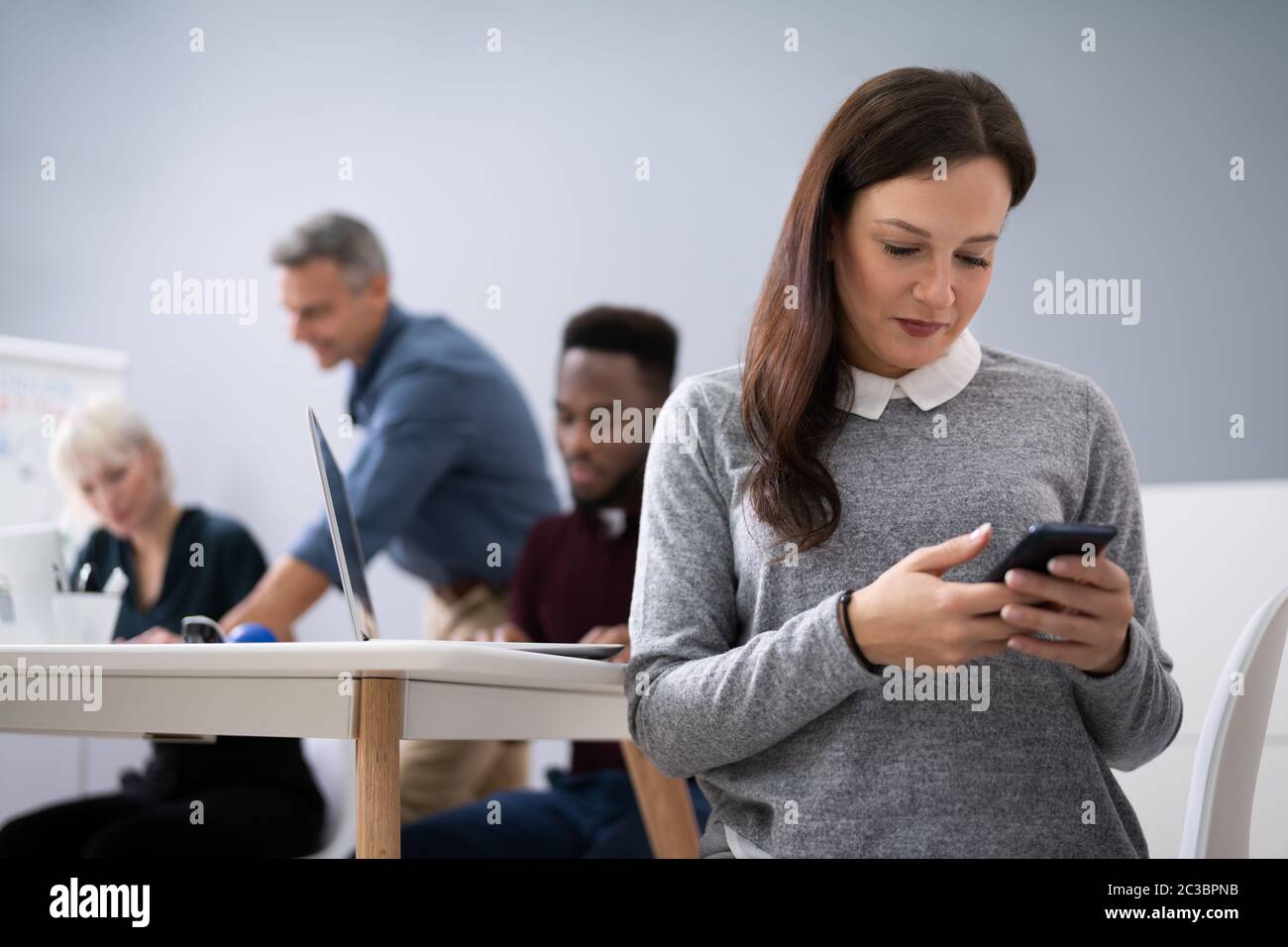 Distracted employee meeting hi-res stock photography and images - Alamy
