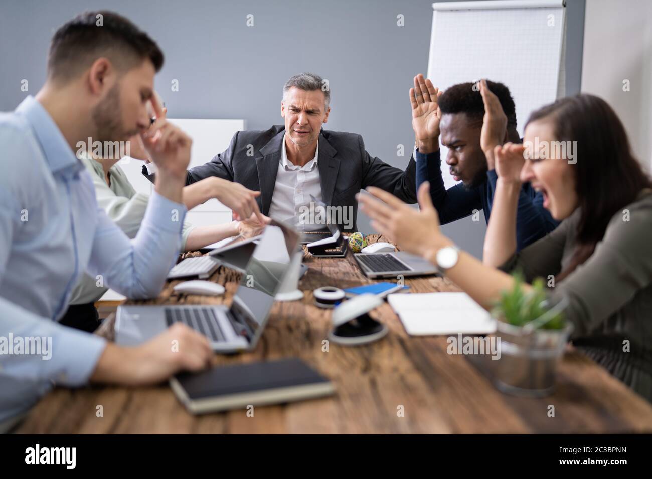 Business Coworkers Arguing To Each Other At Workplace In Office Stock ...