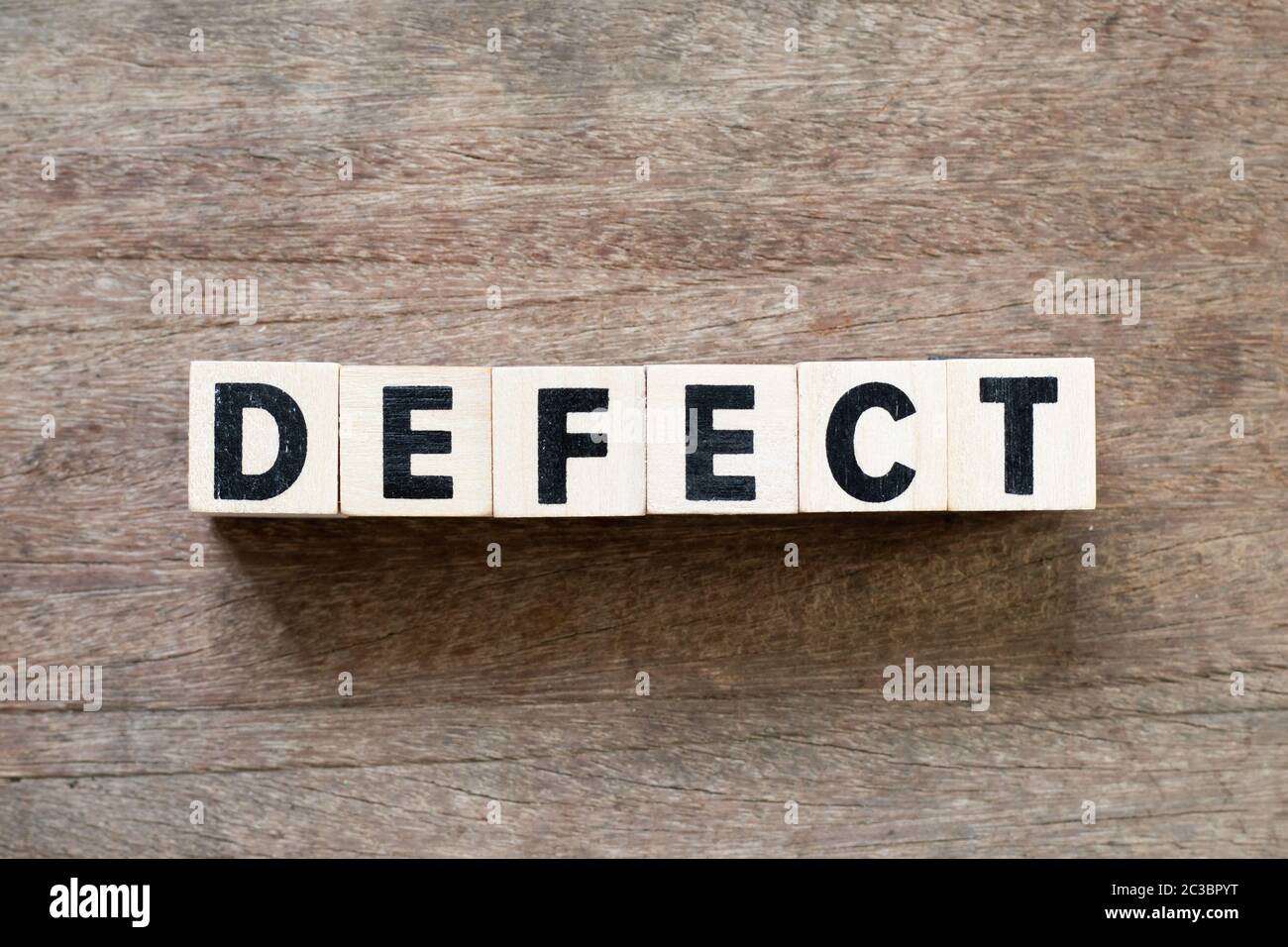 Letter block in word defect on wood background Stock Photo - Alamy