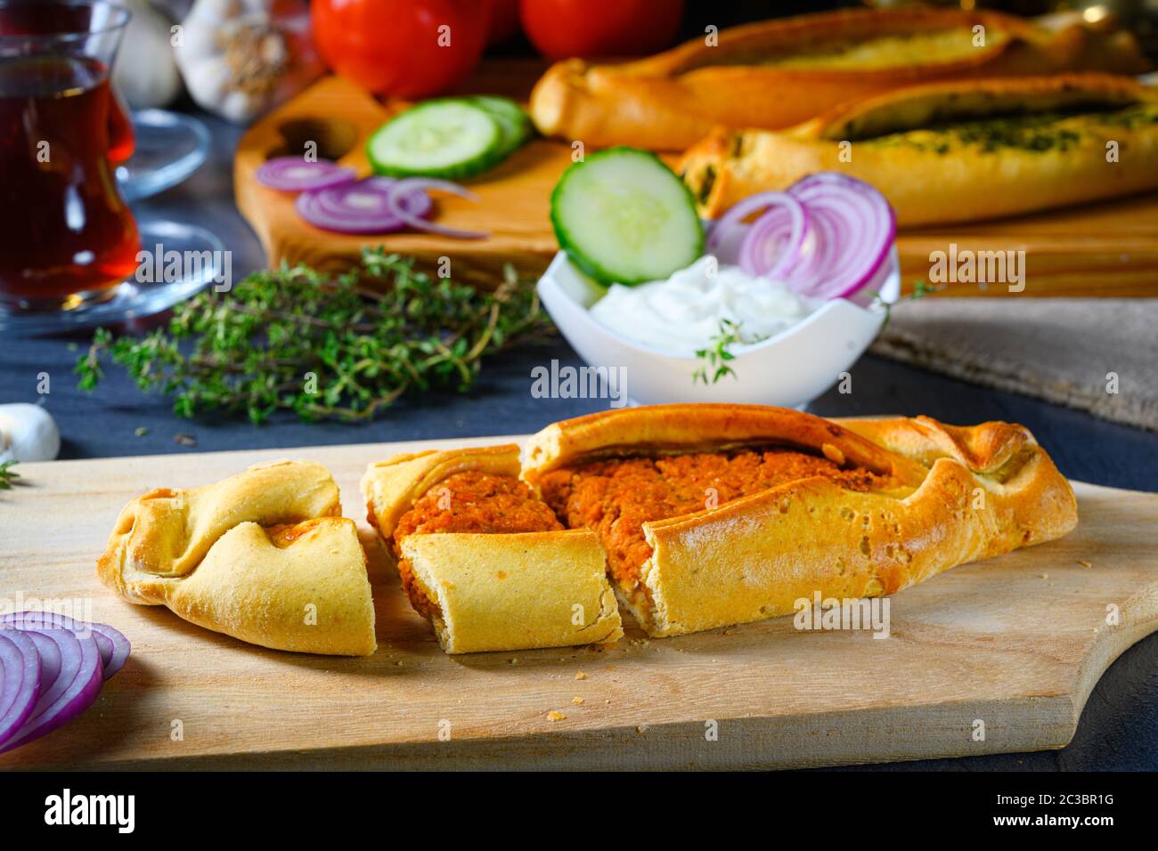 Pide with minced meat, spinach feta and sheep's cheese Stock Photo - Alamy