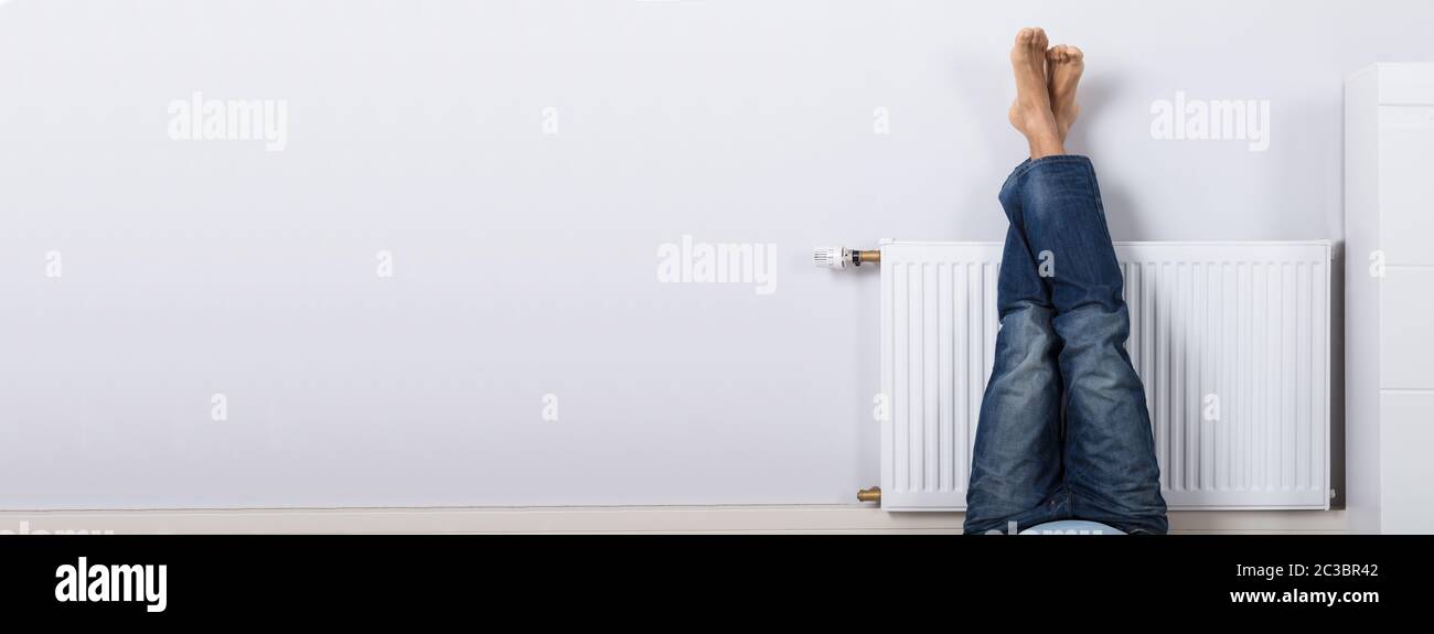 Warm up feet radiator hi-res stock photography and images - Alamy
