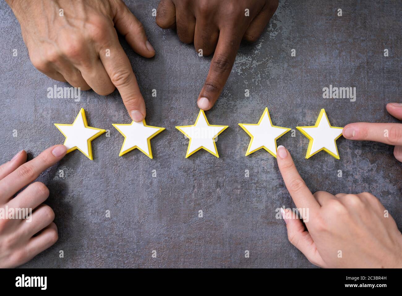 Person Hands Aligning Five Star Rating Icons. High Angle View Stock ...