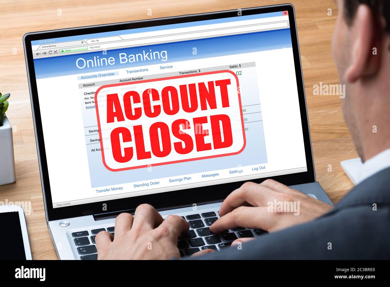 Man Using Online Banking Application On Laptop With Account Closed ...