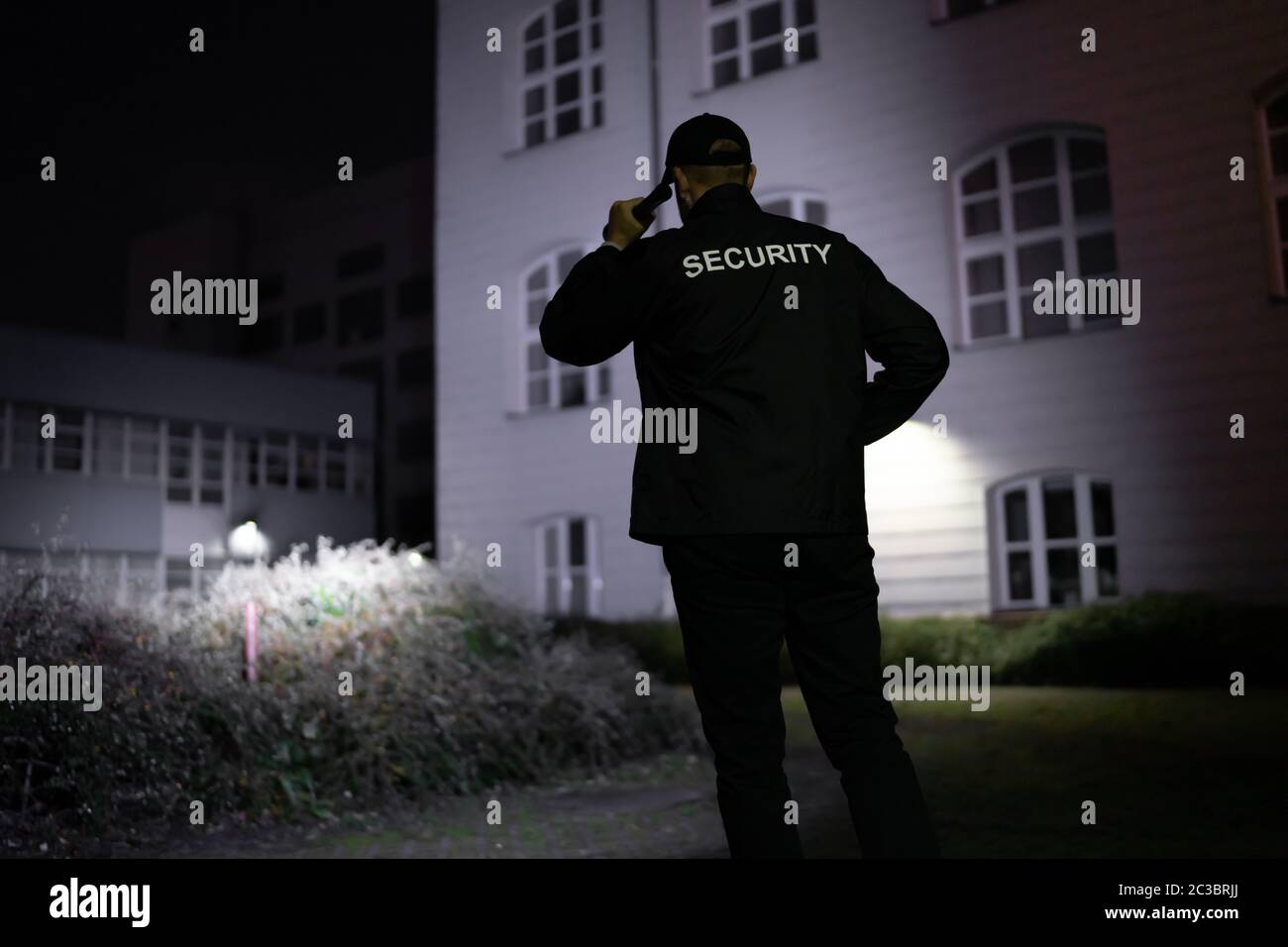 Security Guard Walking Building Perimeter With Flashlight At Night ...