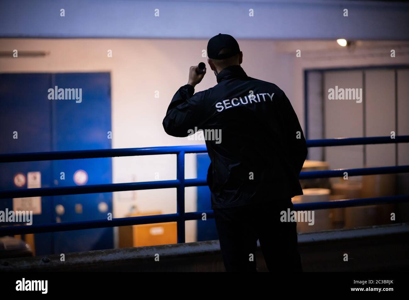 Security Guard Walking Building Perimeter With Flashlight At Night ...