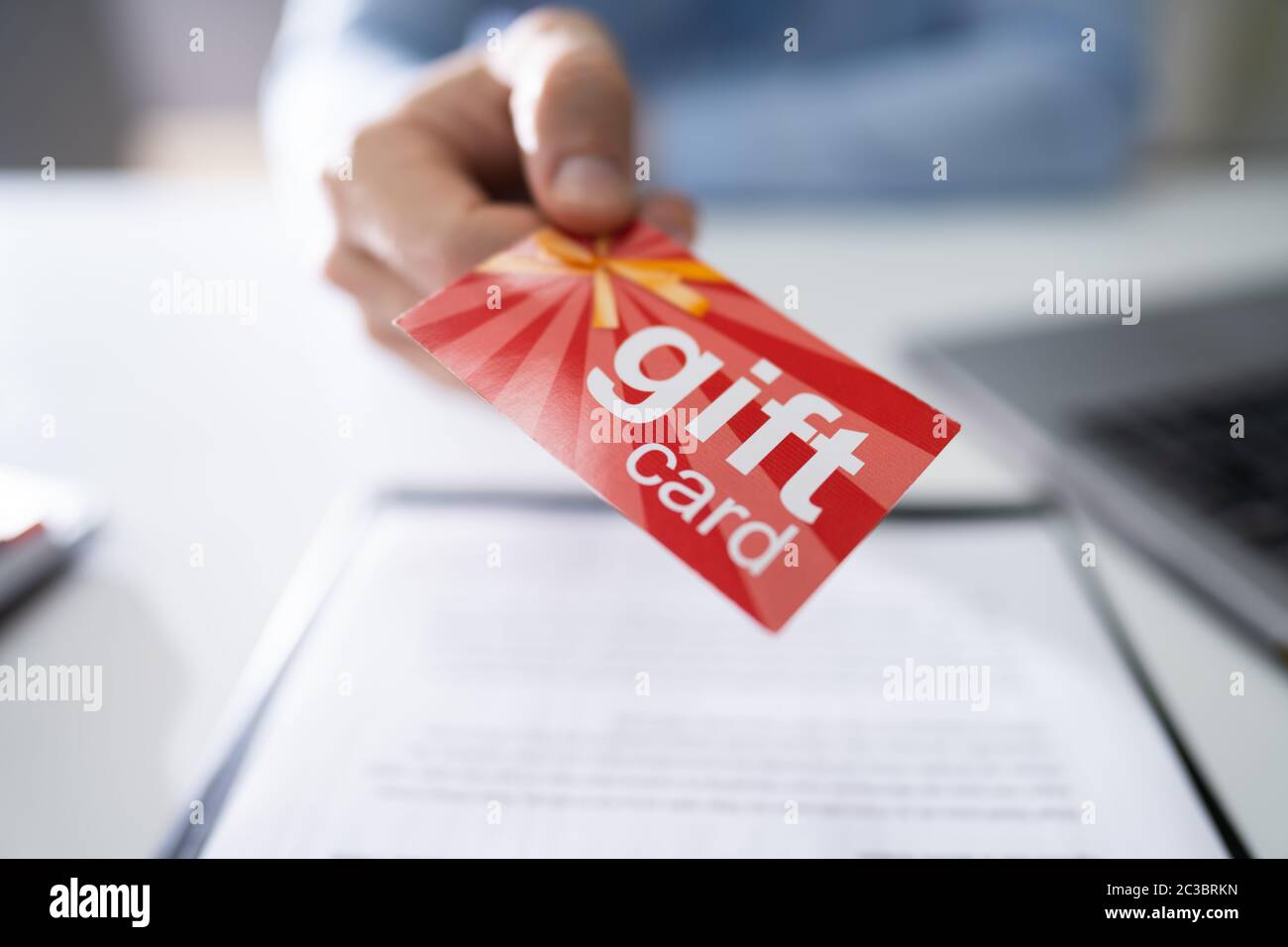 Gift voucher hands hi-res stock photography and images - Alamy