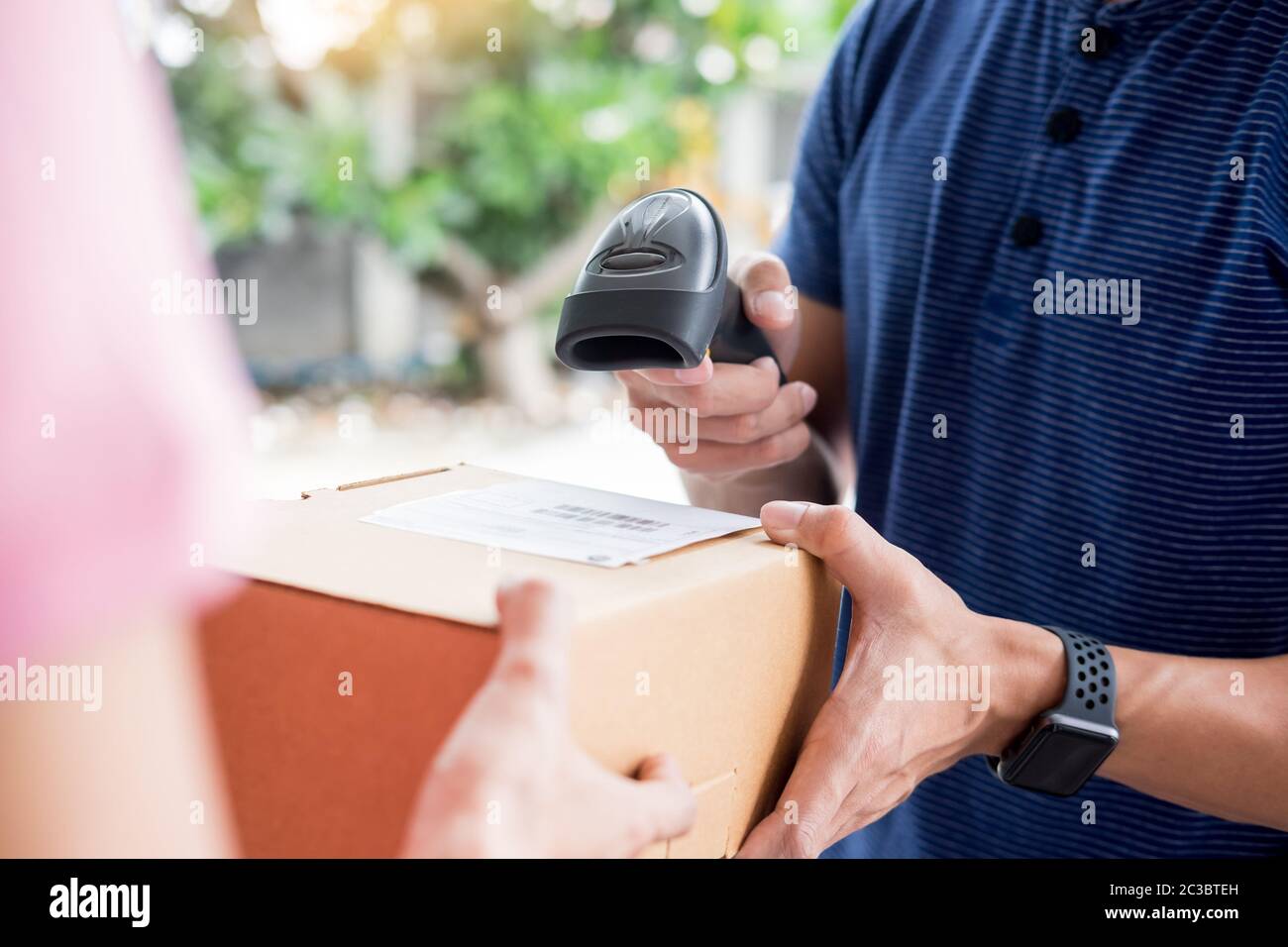 delivery service concept, customer hand receiving a cardboard boxes ...