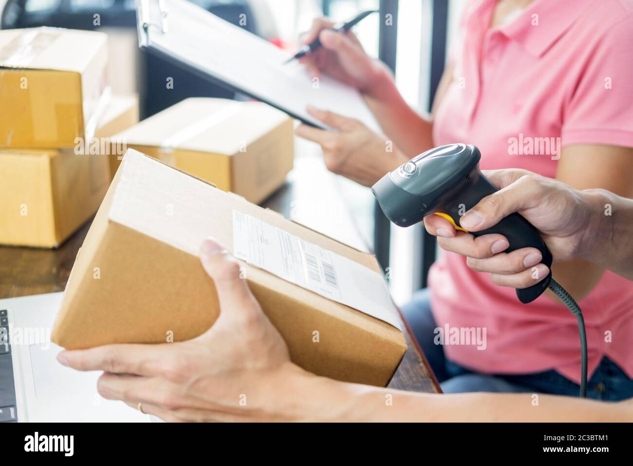 Courier hands Business woman work at home office checking parcel ...