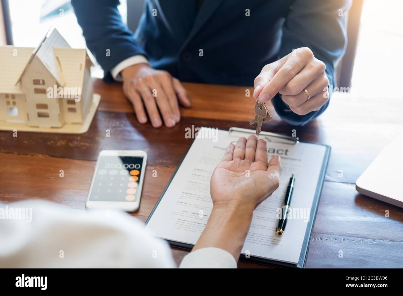 agent getting keys to customer new house, hand of real estate agent or ...