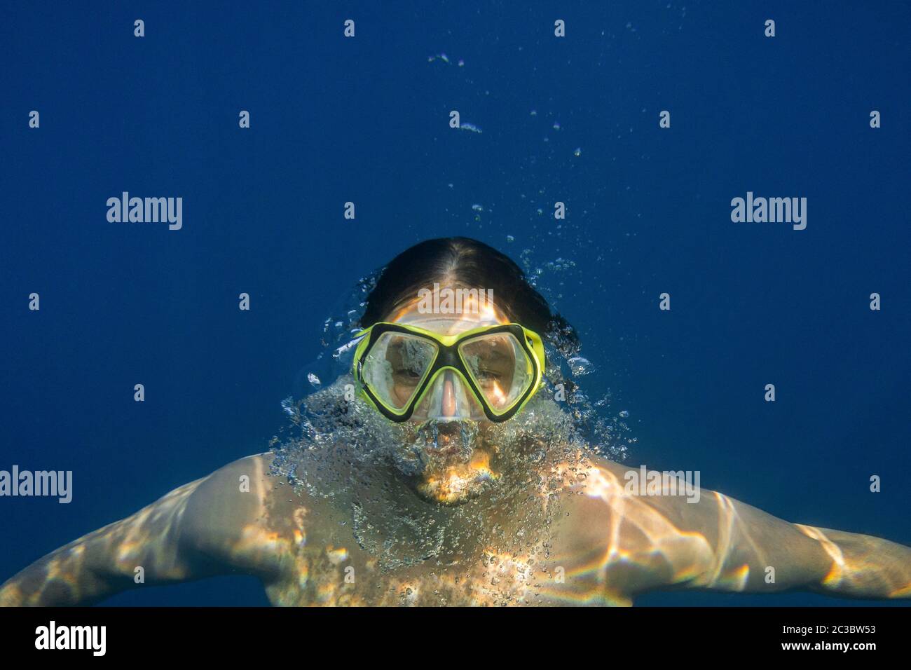 Male diver in blue water. Open sea, ocean, swimming, active travel and ...