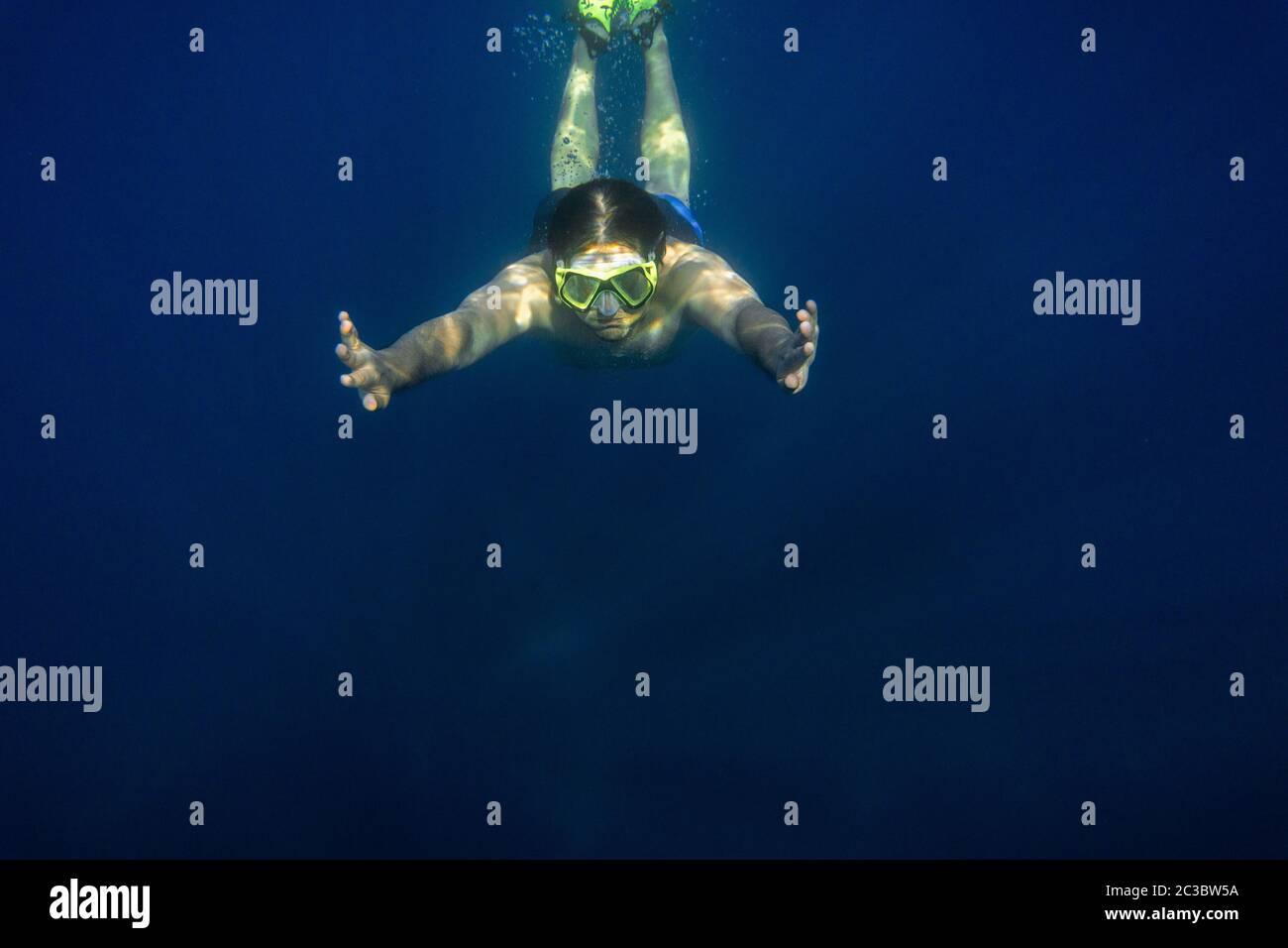 Male diver in blue water. Open sea, ocean, swimming, active travel and ...