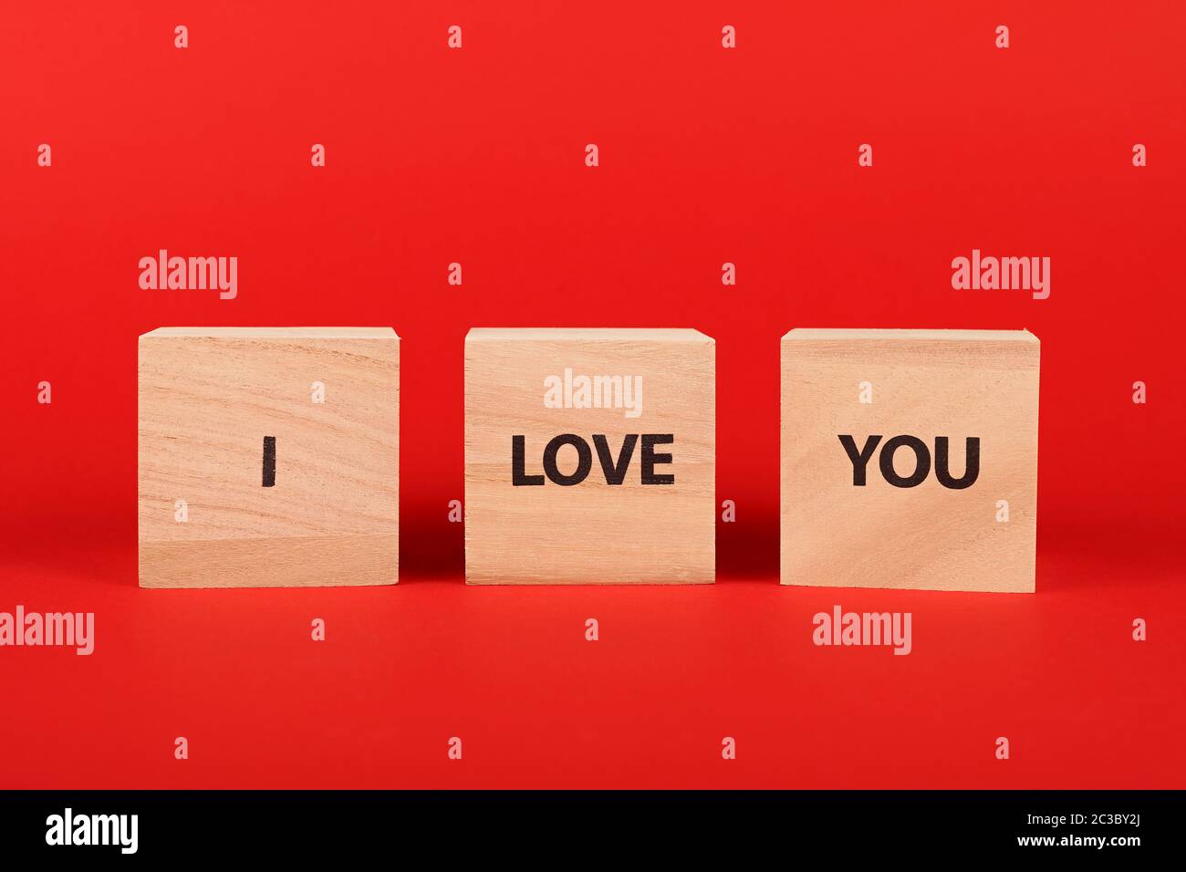 Close up three wooden cube signs with LIFE IS FUN words over red ...
