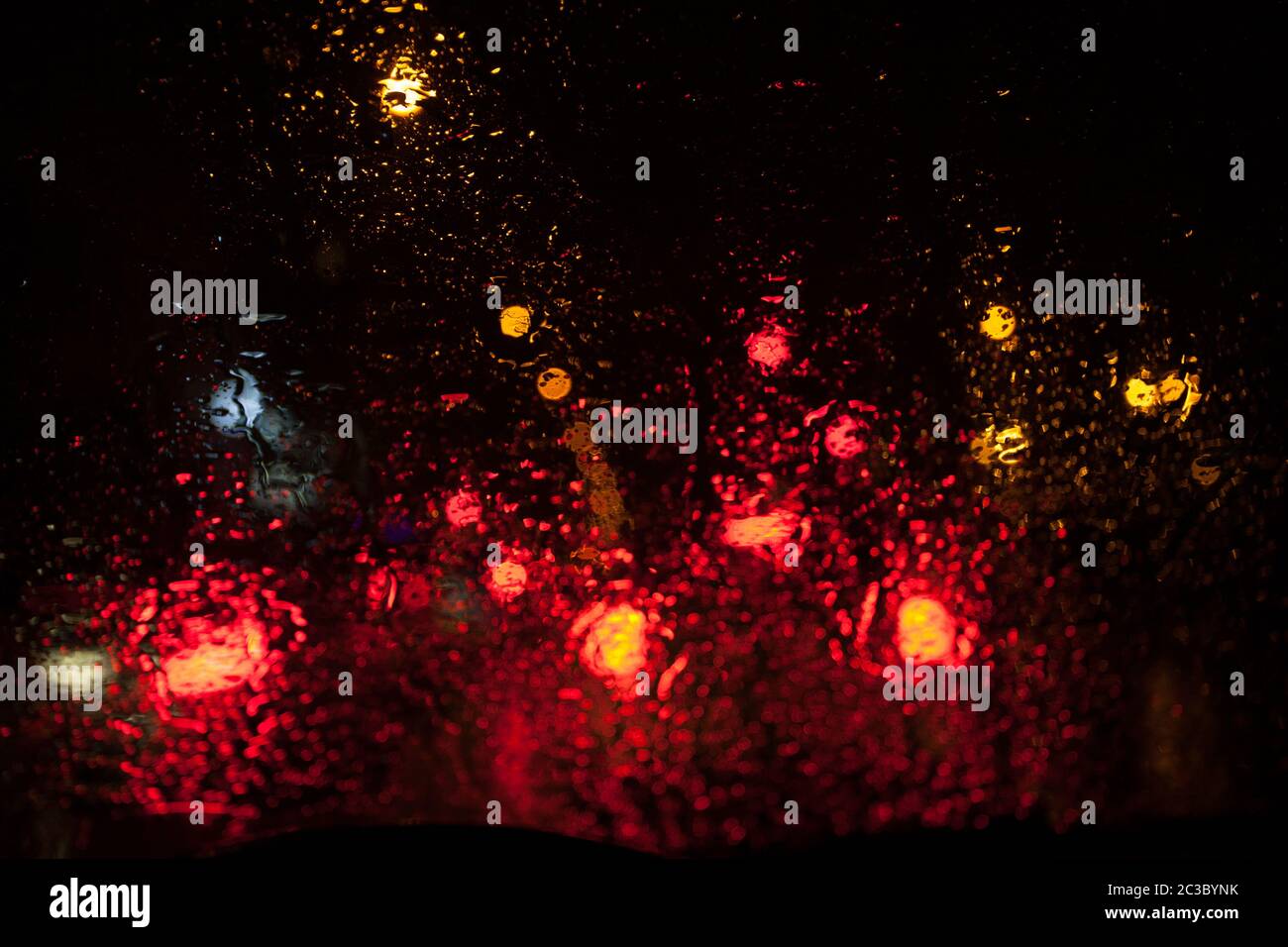 Colorful Water Drops on glass in night Stock Photo - Alamy