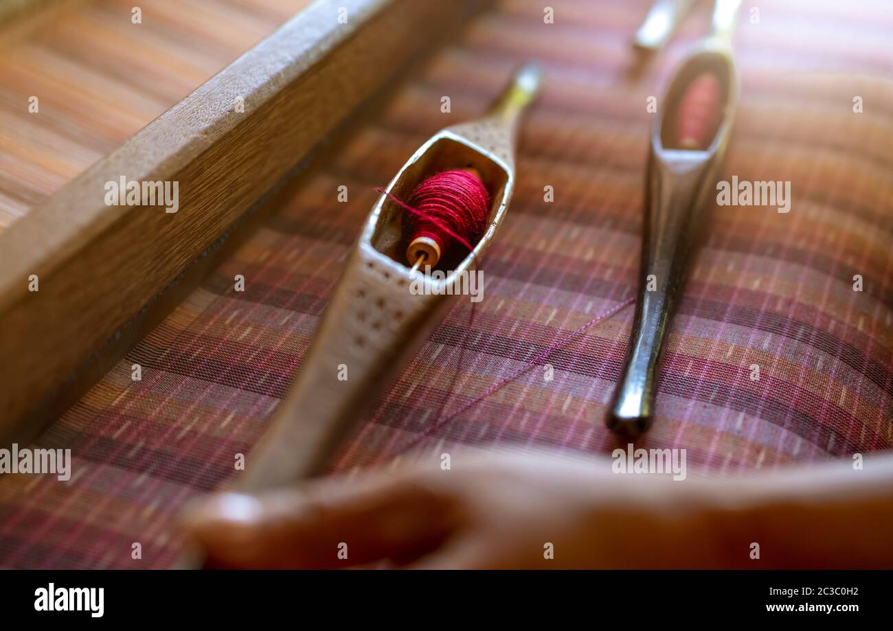 Woman working on weaving machine for weave handmade fabric. Textile ...