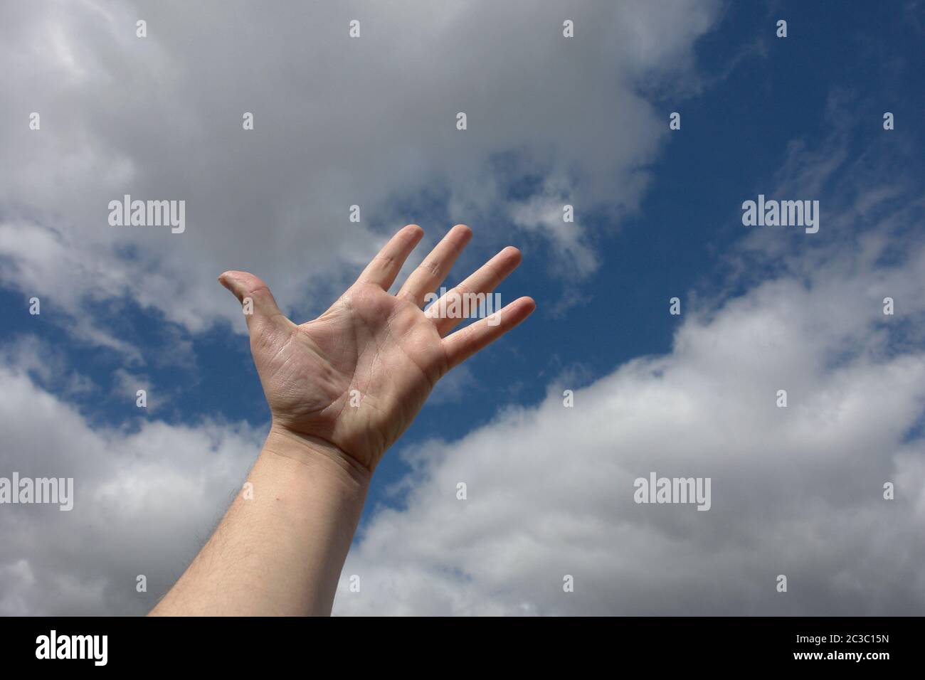 hand in the sky Stock Photo - Alamy