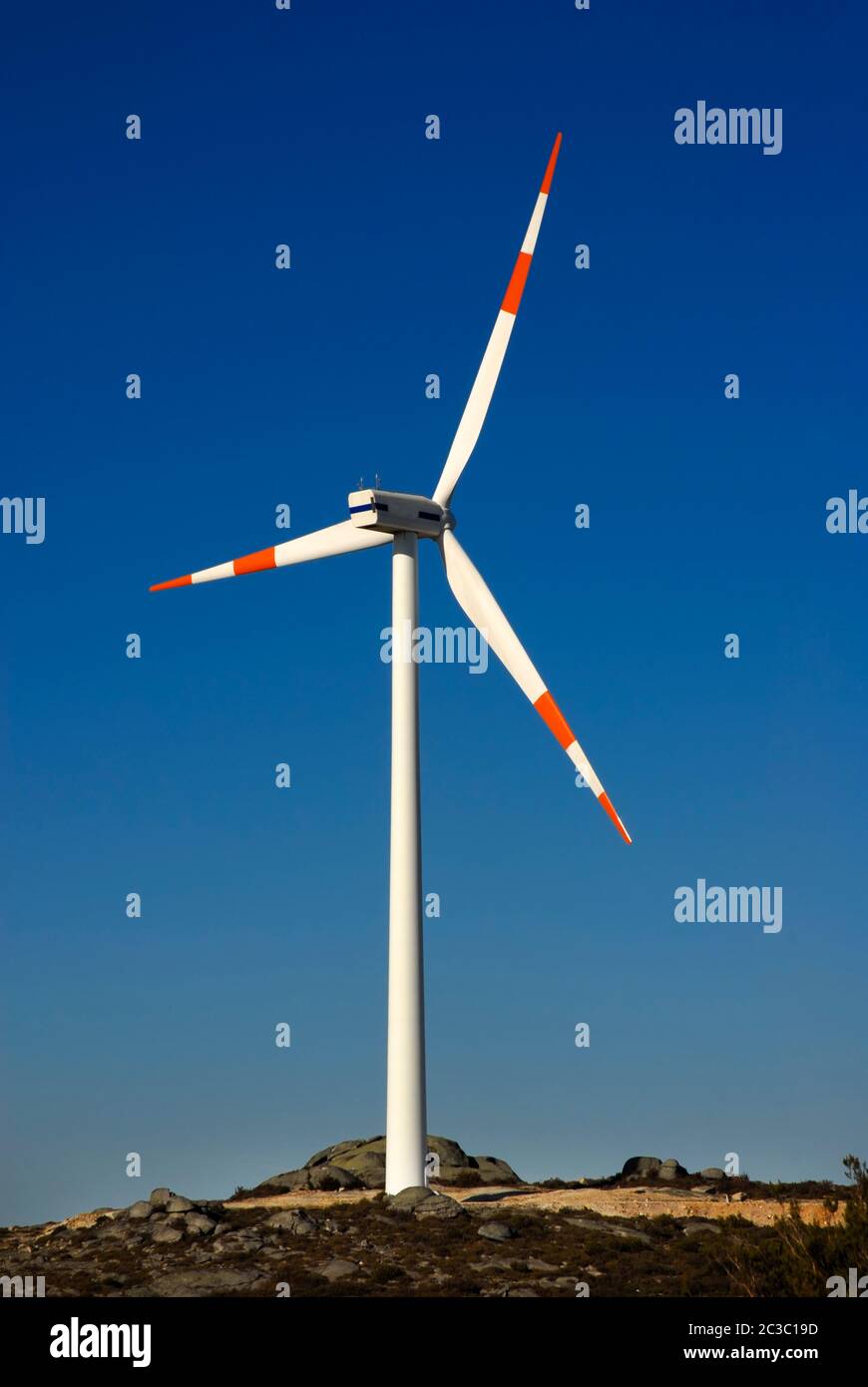 Modern white wind turbine or wind mill producing energy Stock Photo - Alamy