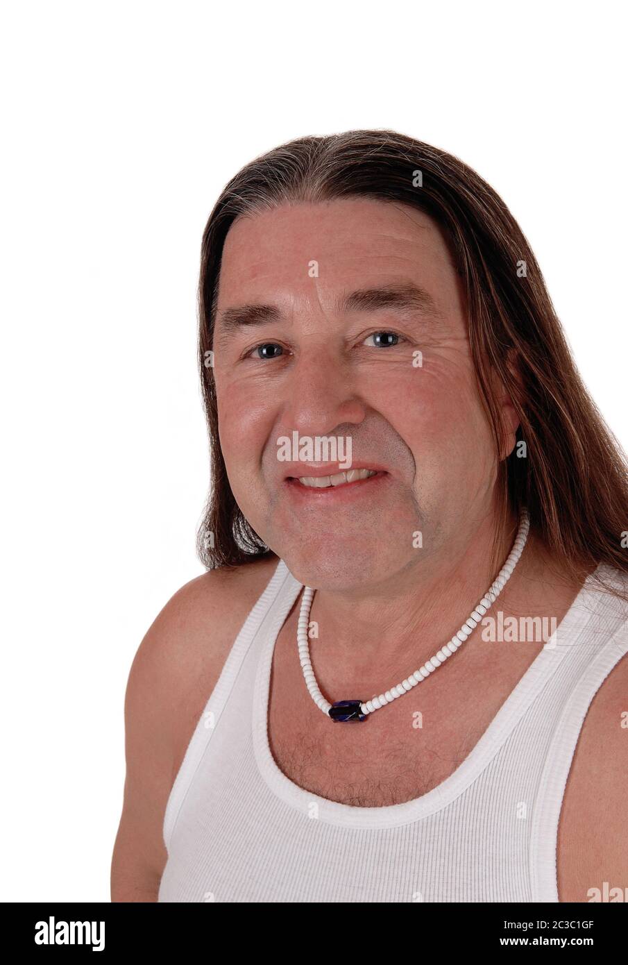 A happy indigenous man posing for a portrait image with his long ...