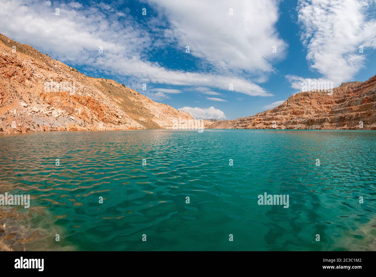Emerald green lake in flooded opencast mine, open pit. Oval lake in ...