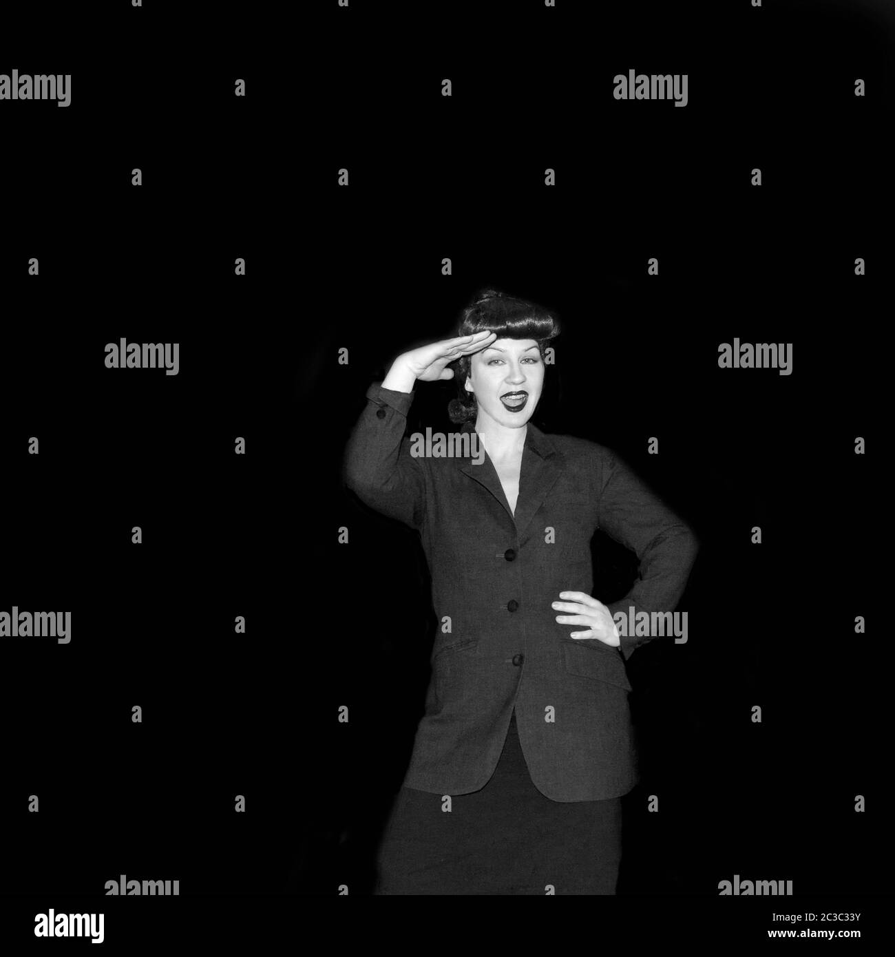 Female with 1940's style hair and makeup. Brunette victory roll, red ...