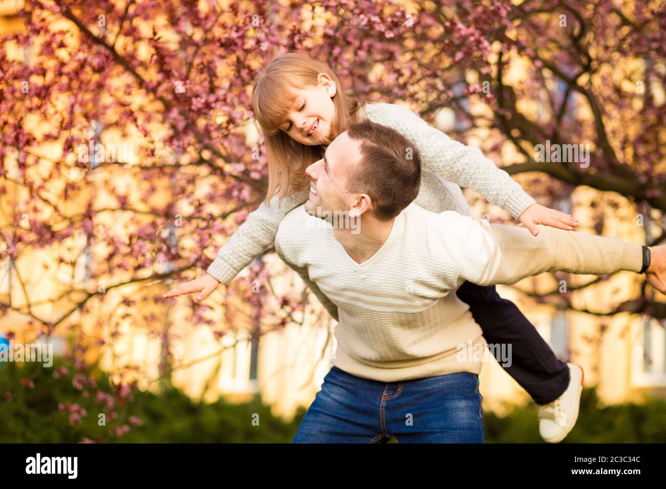 Happy father and child spending time outdoors. Lets fly. Family support ...