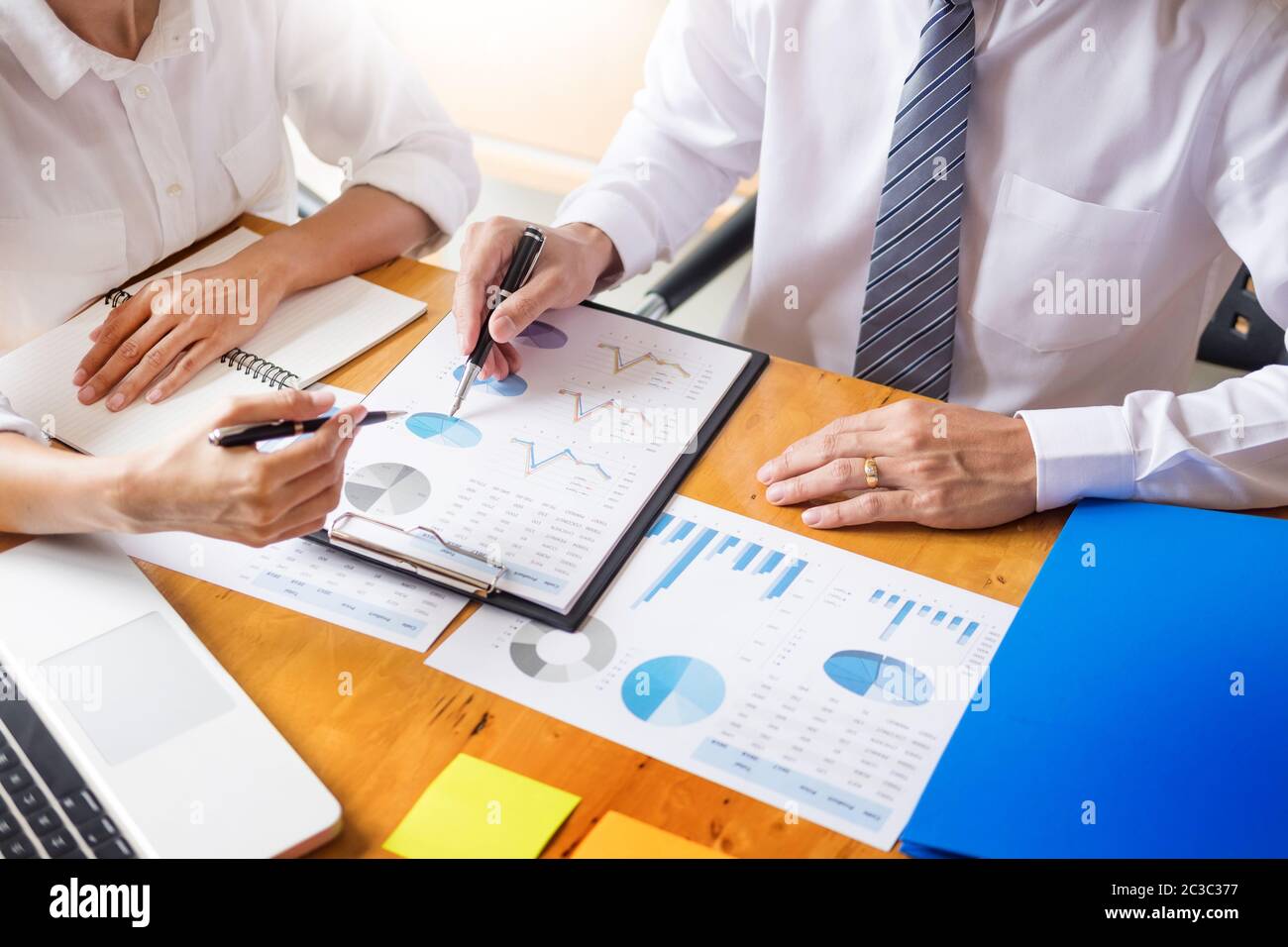 Business team data analyzing income charts document during discussion ...