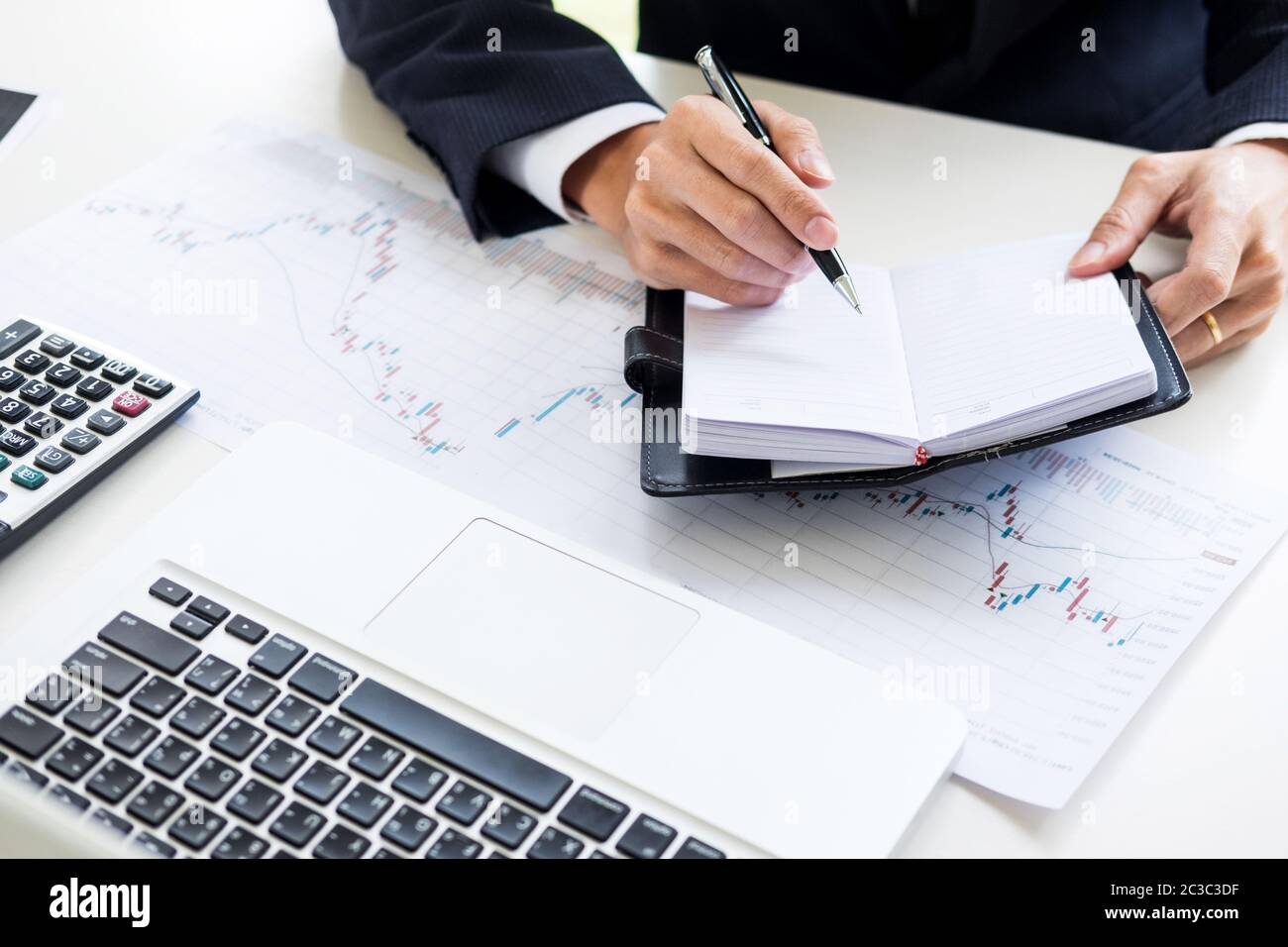 Investor analyzing financial reports of stock trading Market Graph ...
