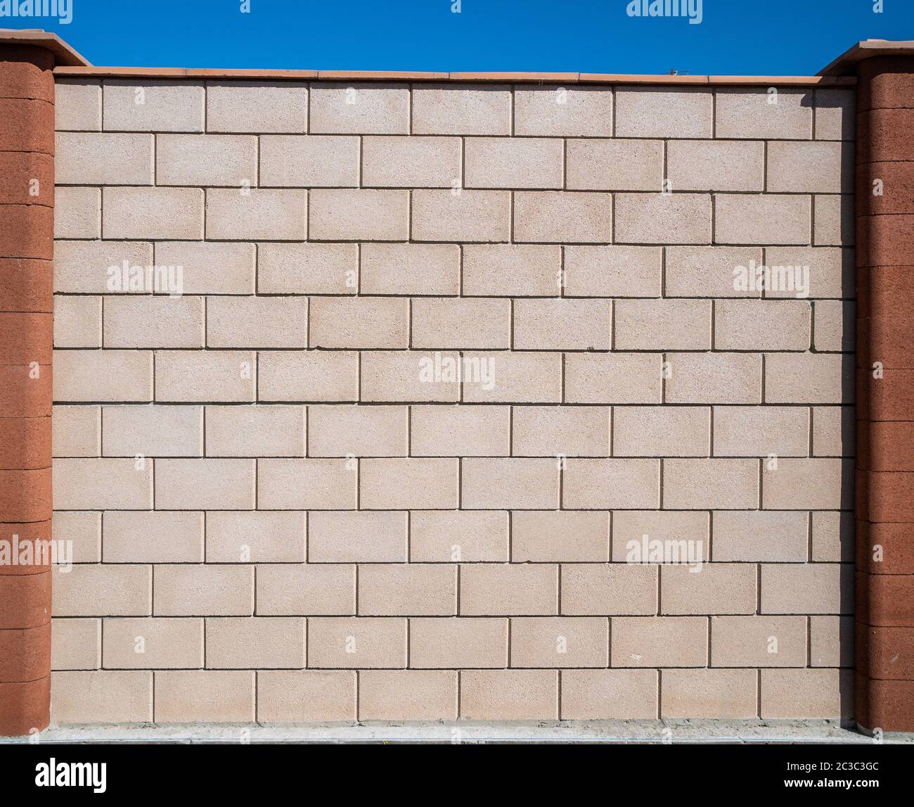 White grey brick wall with orange columns concrete texture. Grunge ...
