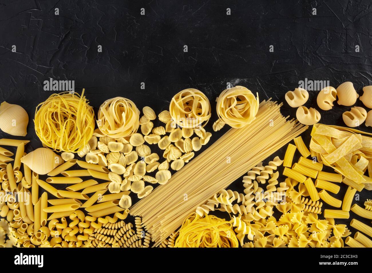 Italian pasta banner with copyspace, a flatlay of a variety of pasta ...