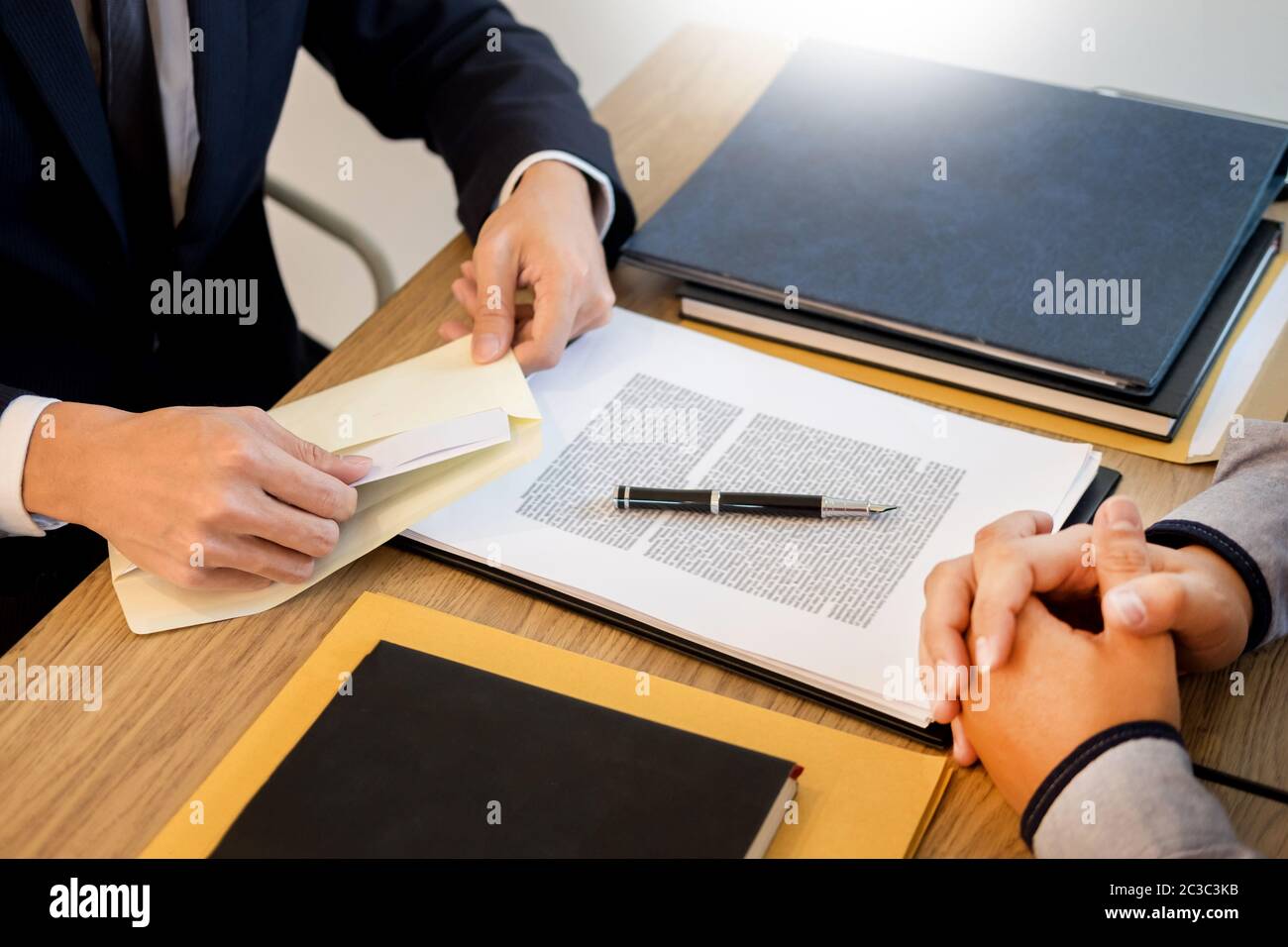businessman hand sending a resignation letter to executive boss ...