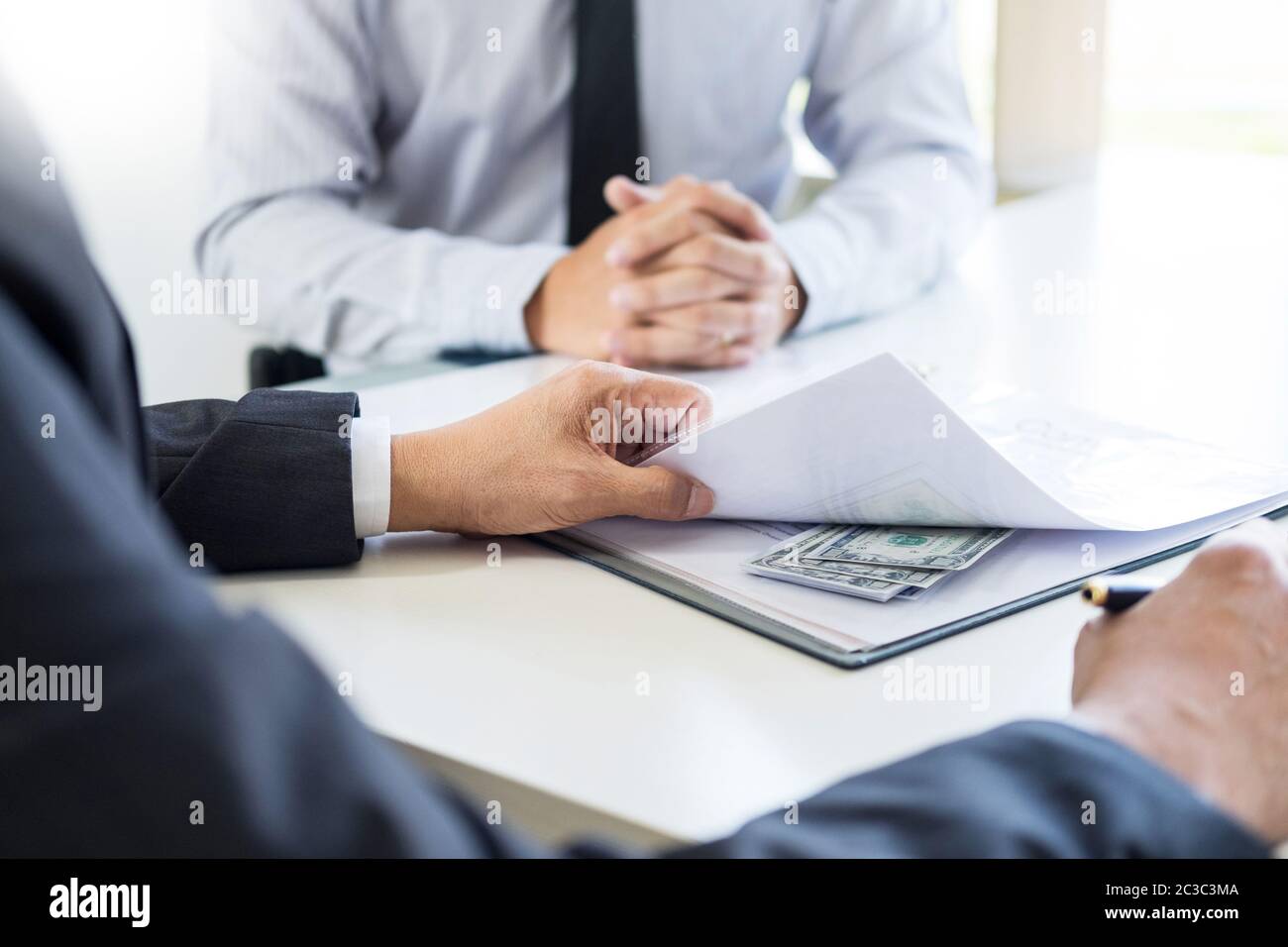 Businessman receive money in the envelope offered in file taking bribe ...