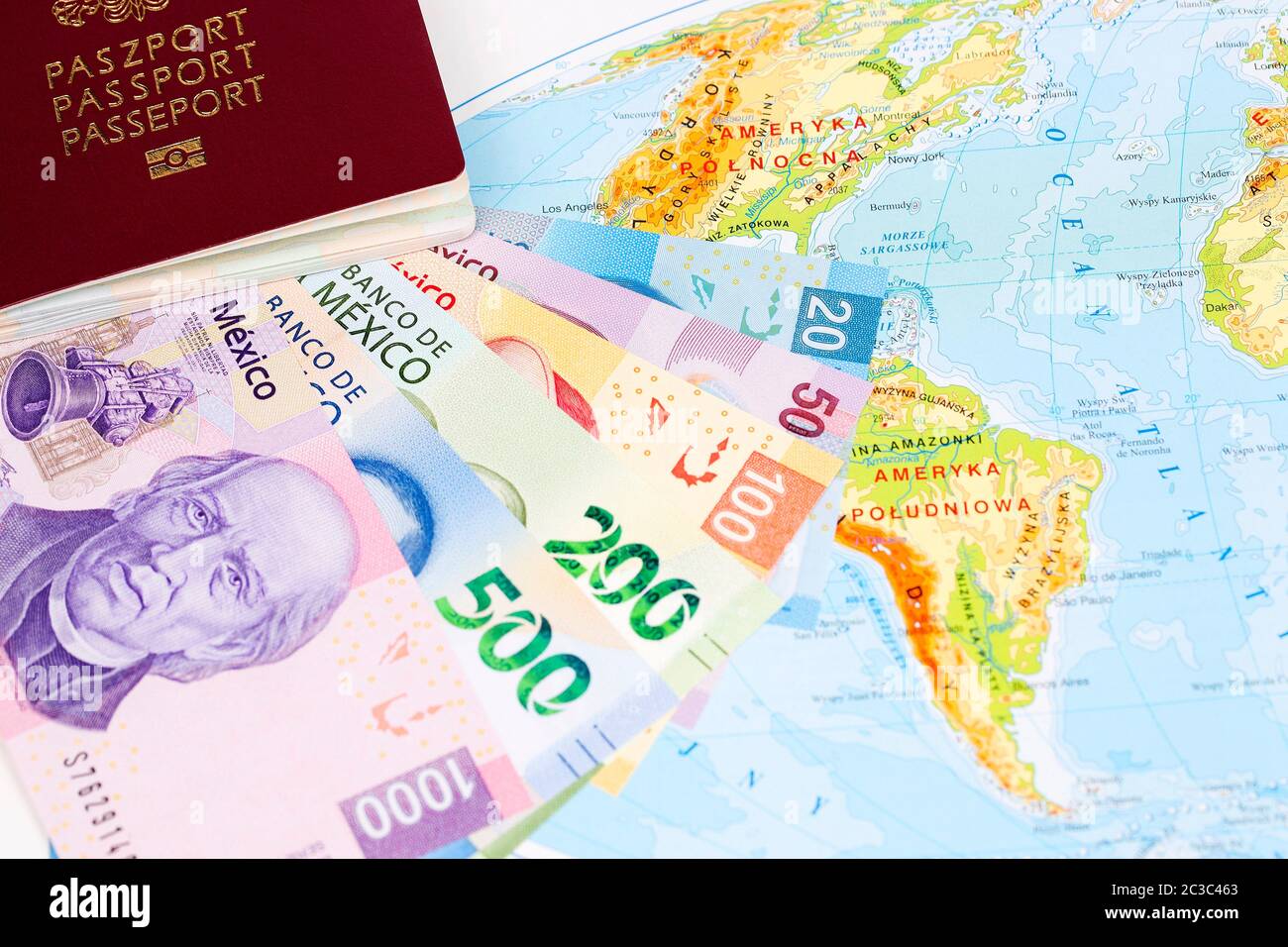 Mexican Pesos with passport on the map Stock Photo - Alamy