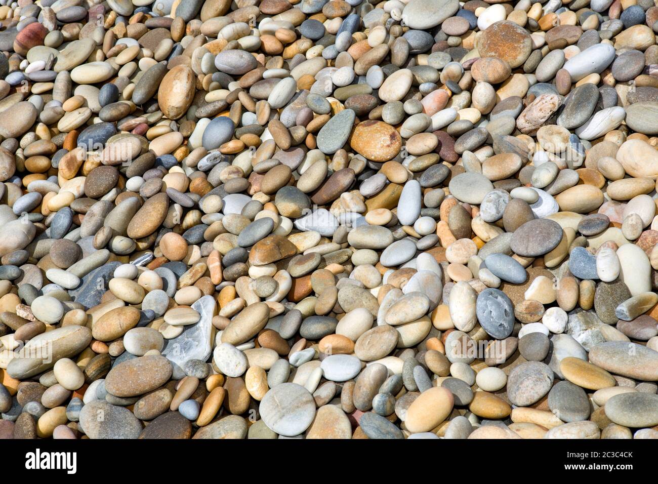 colorful pebble stone background, at the beach Stock Photo - Alamy
